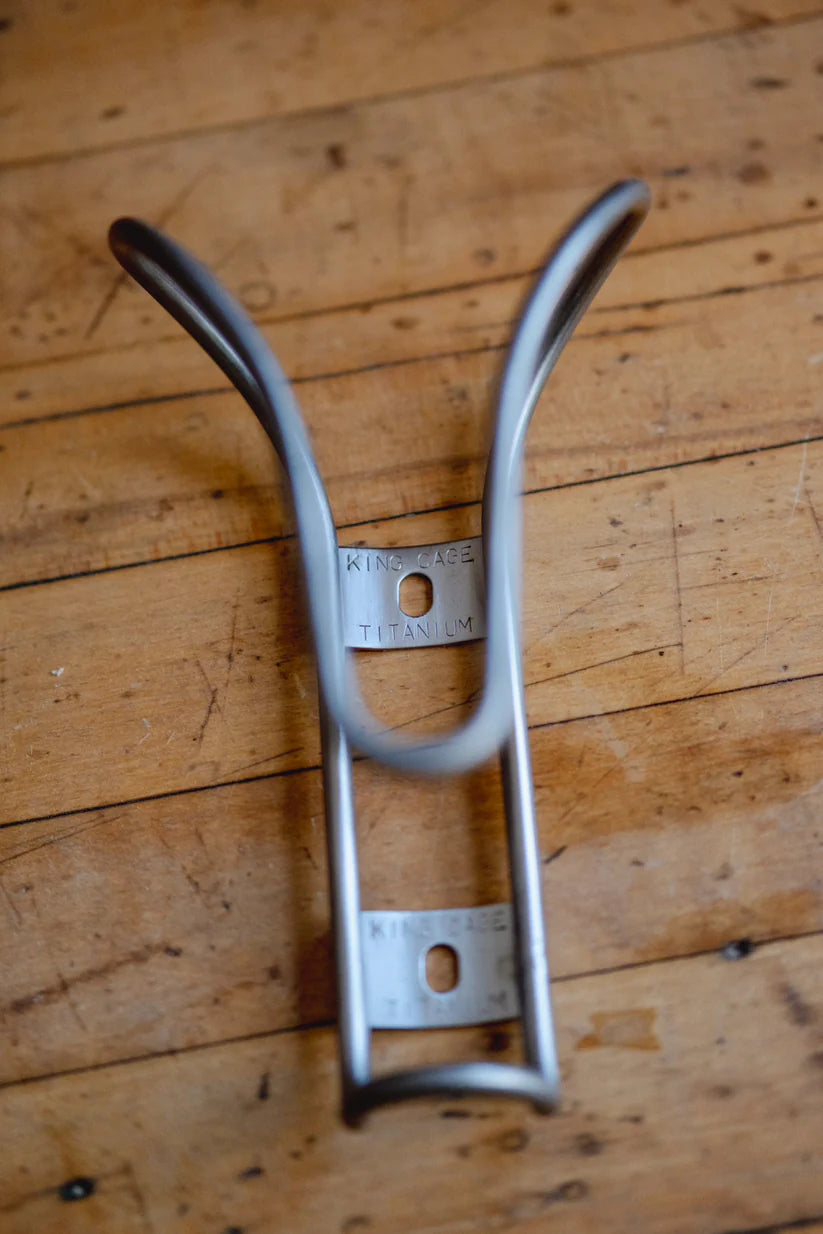 NEW King Cage Titanium Iris Bottle Cage – Around the Cycle